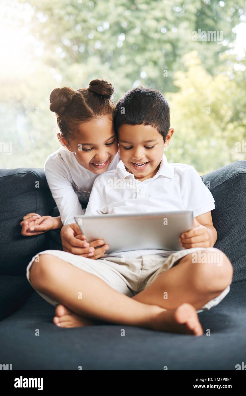 Closeup of a mixed race brother and sister playing together using their ...