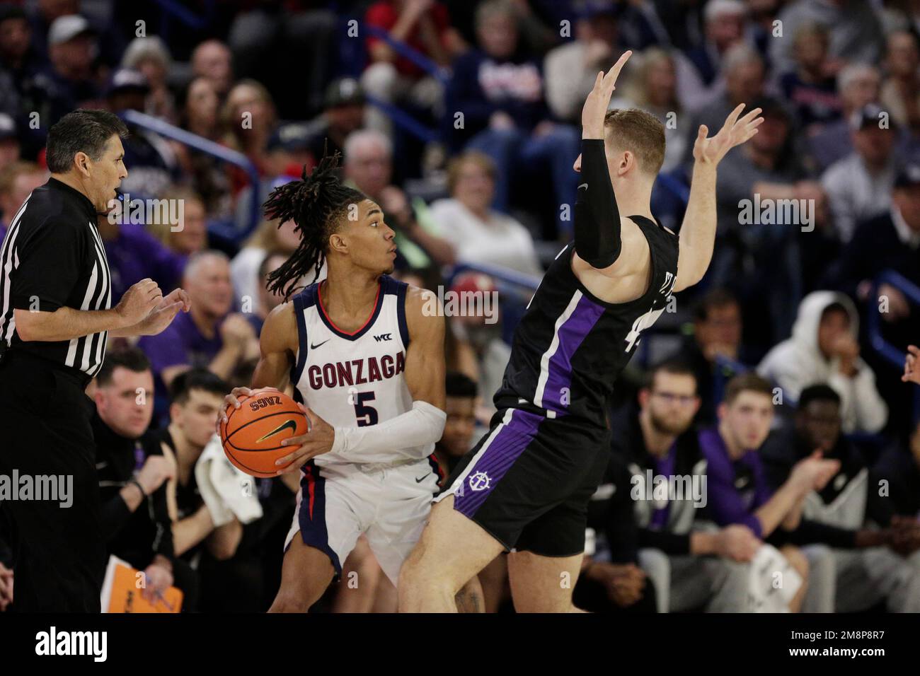Gonzaga guard Hunter Sallis, left, controls the ball while defended by ...