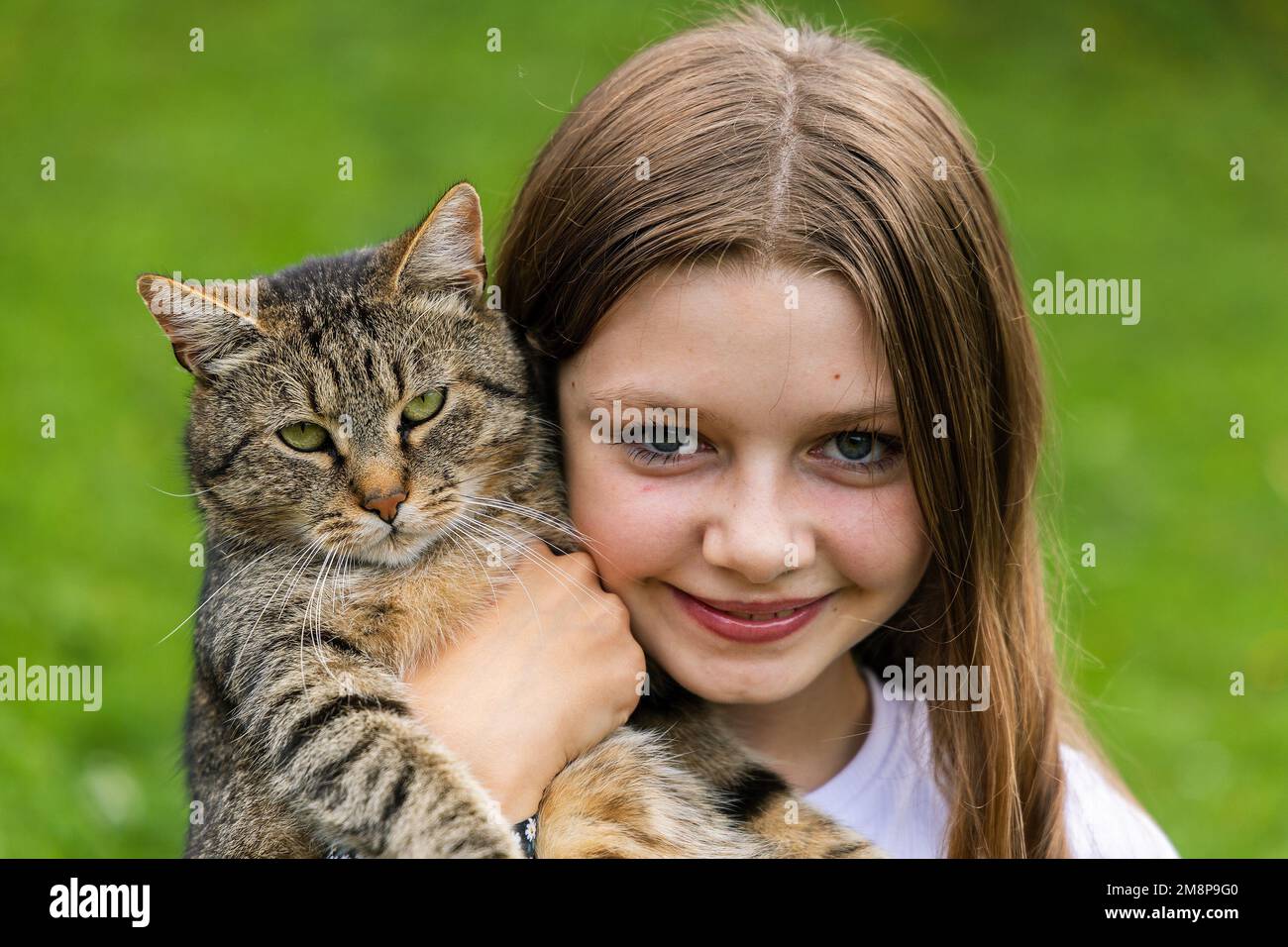 A girl with her cat Stock Photo - Alamy