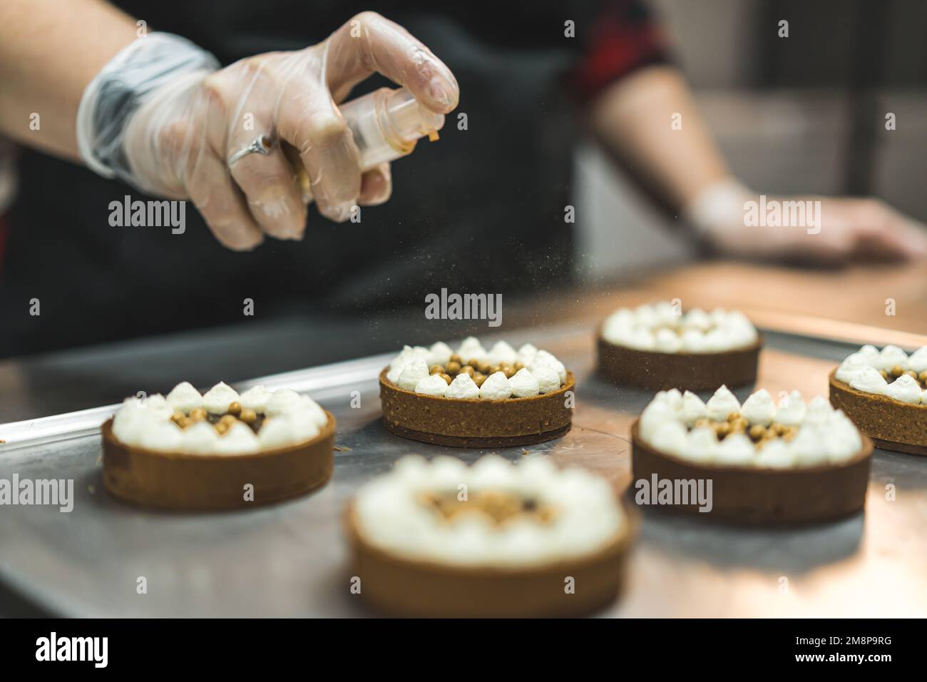 Female baker wearing apron gloves hi-res stock photography and images ...