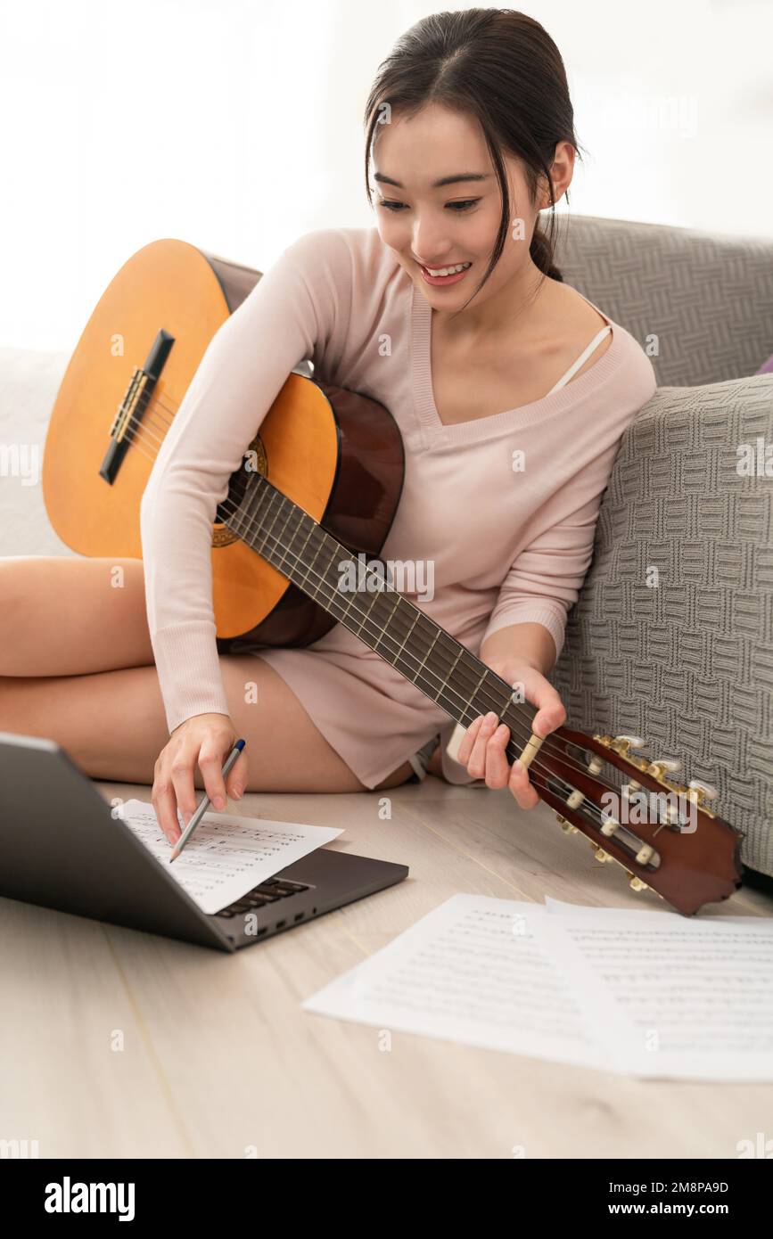 The young woman the bullet guitar Stock Photo - Alamy