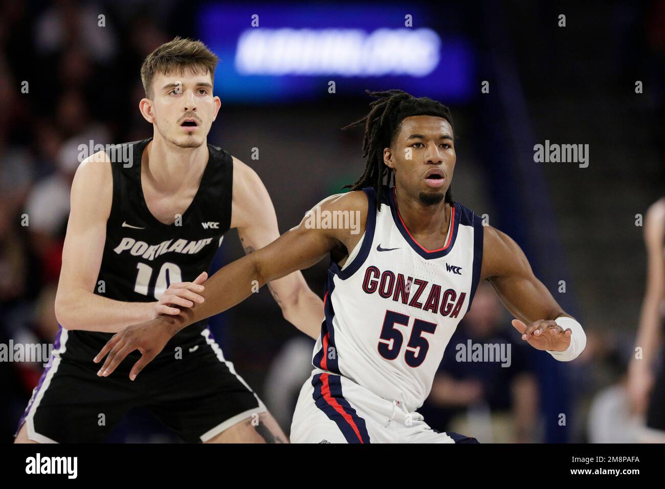 Portland forward Coleman Lemke (10) and Gonzaga guard Dominick Harris ...
