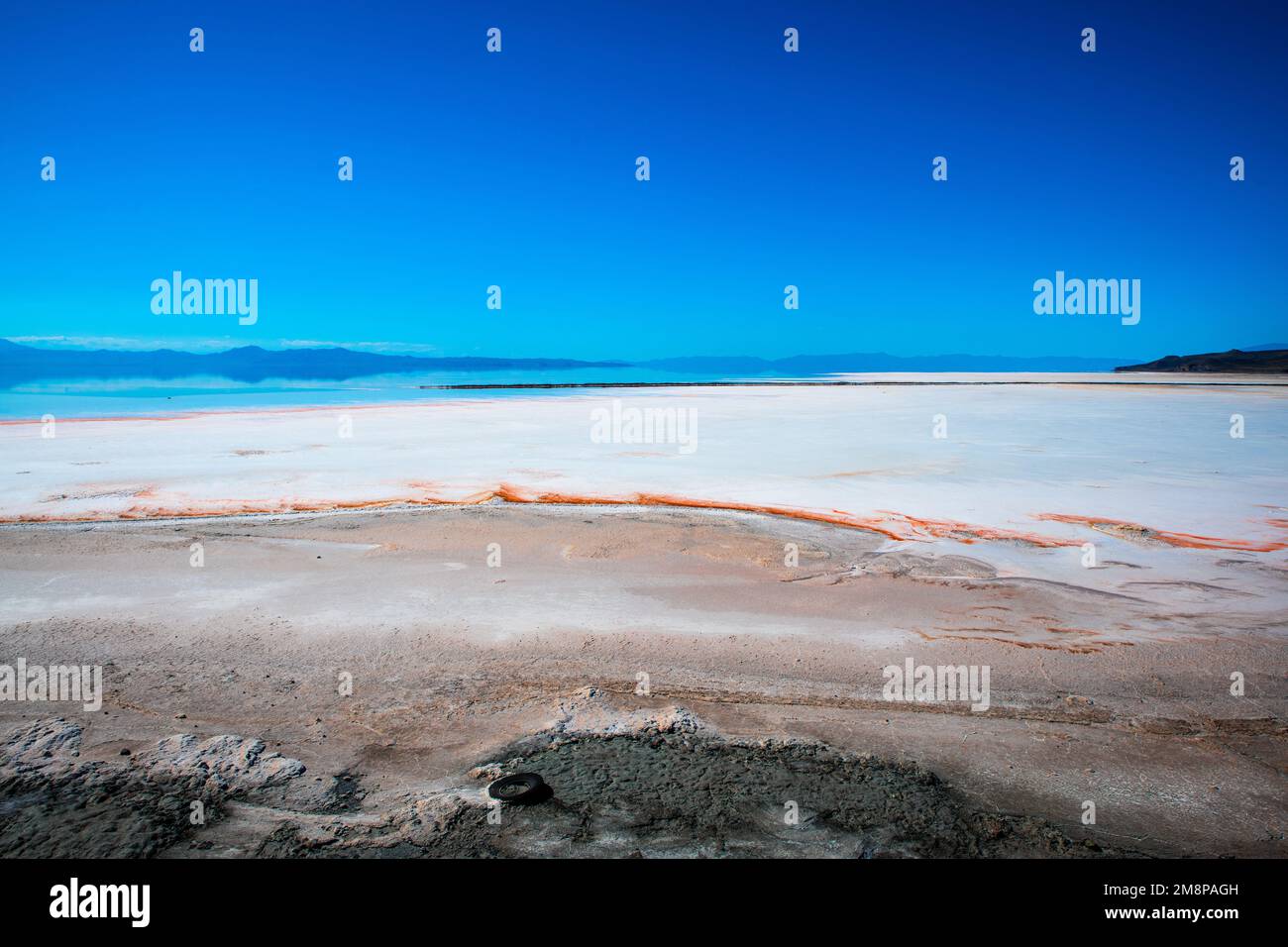 A scenic view of Lake Urmia in Iran under a cloudless blue sky on a ...