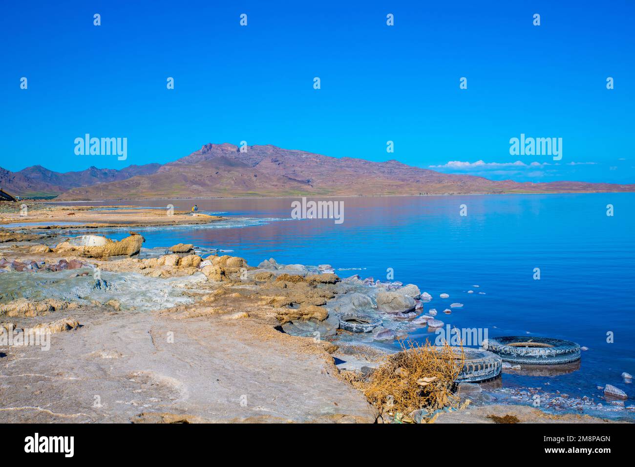 A scenic view of rocky shore of Lake Urmia in Iran under a cloudless ...