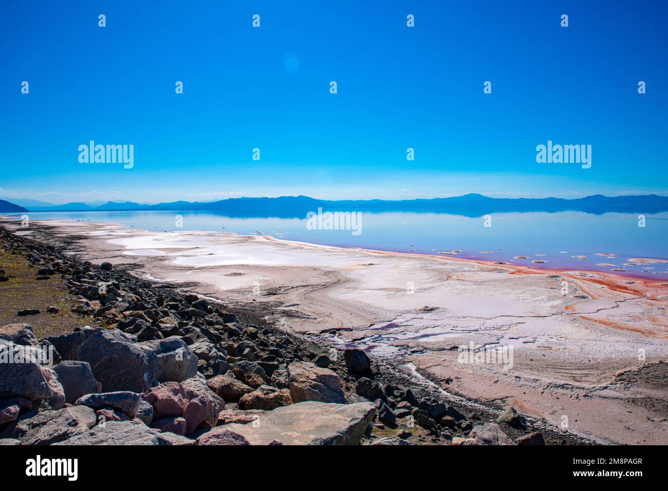 A scenic view of Lake Urmia in Iran under a cloudless blue sky on a ...