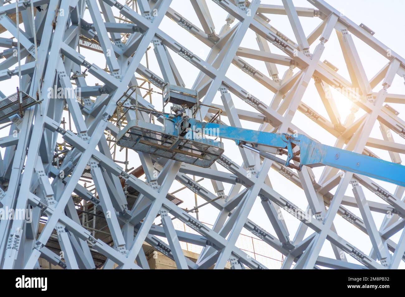 Metal frame lattice building decoration, with tower lift and cradle ...