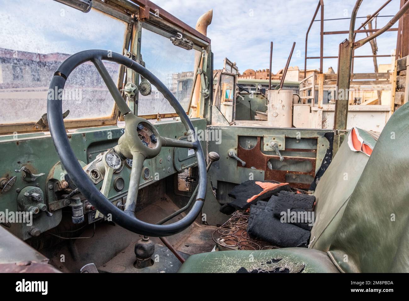 Abandoned and rusty military vehicles in the middle of the desert Stock ...