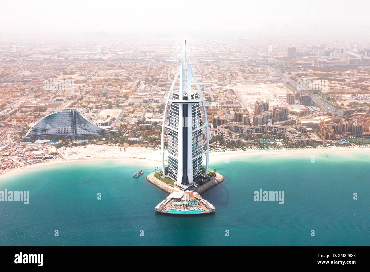 Aerial symmetrical view of the Burj Al Arab hotel from the sea in a ...