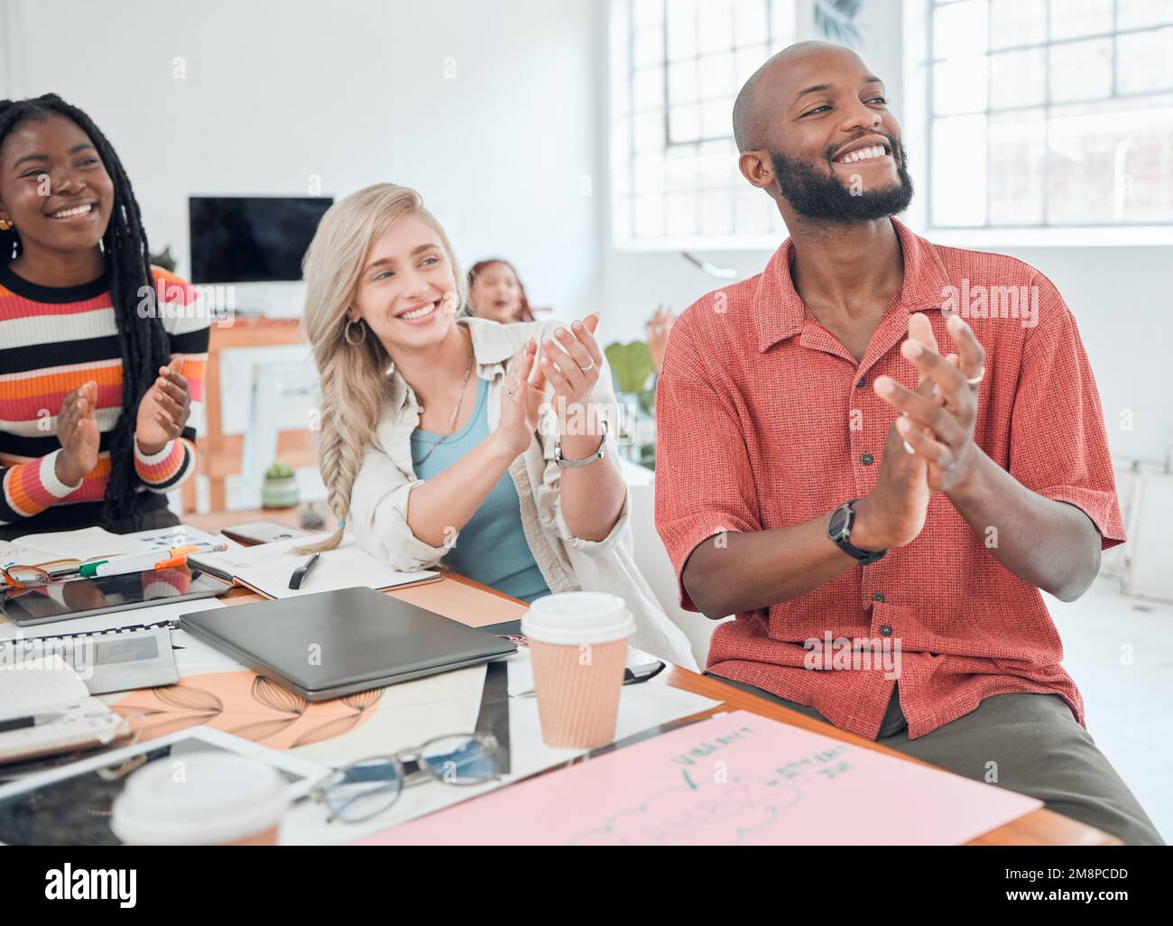 Group of happy diverse businesspeople having a meeting in a modern ...
