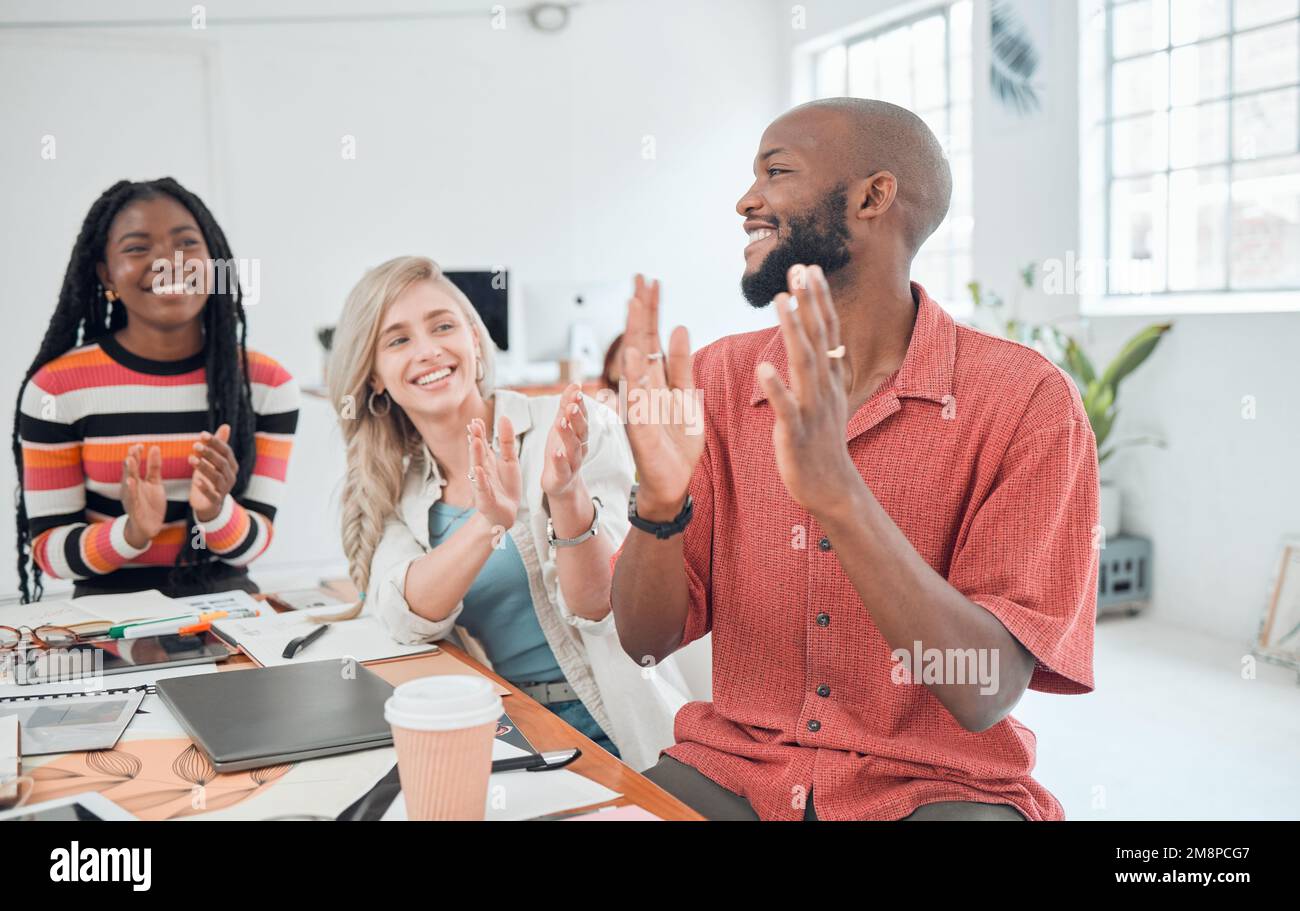 Group of cheerful diverse businesspeople having a meeting in a modern ...