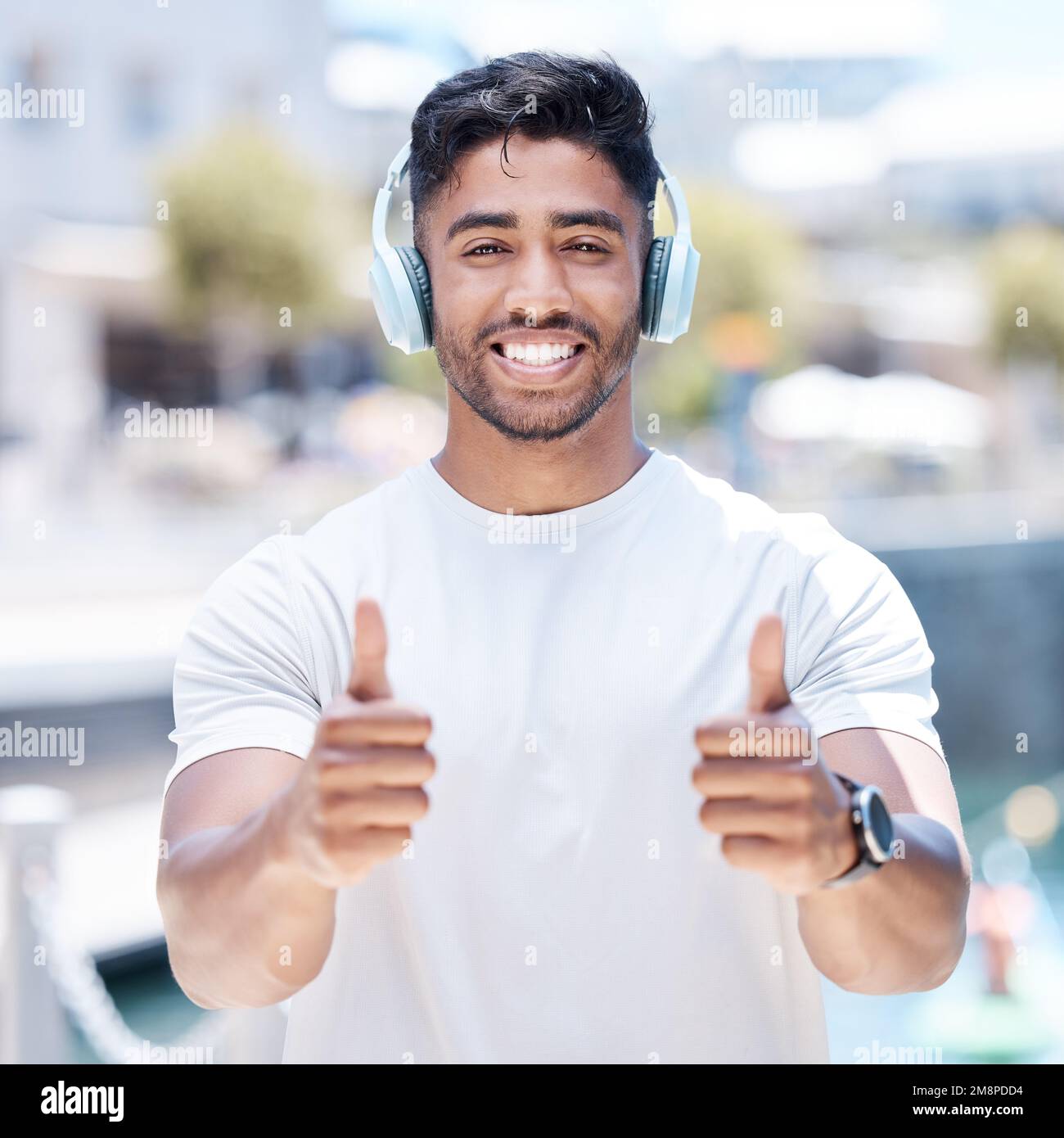 Young happy male headphones thumbs hi-res stock photography and images ...