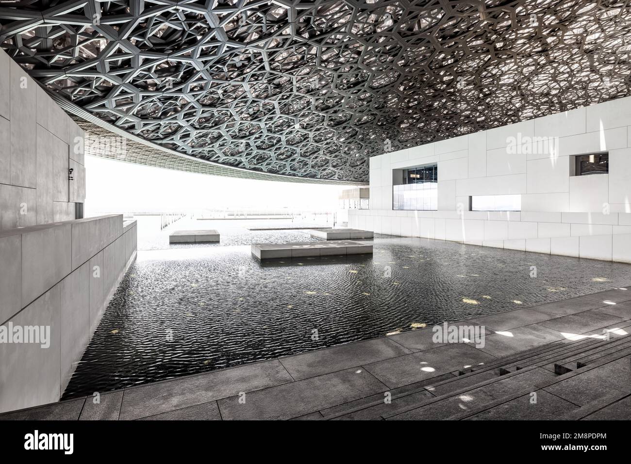 Atrium of the Louvre museum in Abu Dhabi, with latticework dome, marble ...