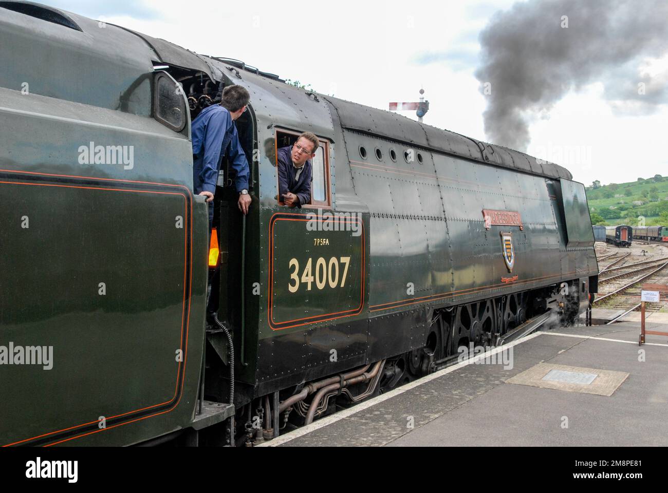 Driver and fireman on the footplate on the 1945 built 34007 steam ...