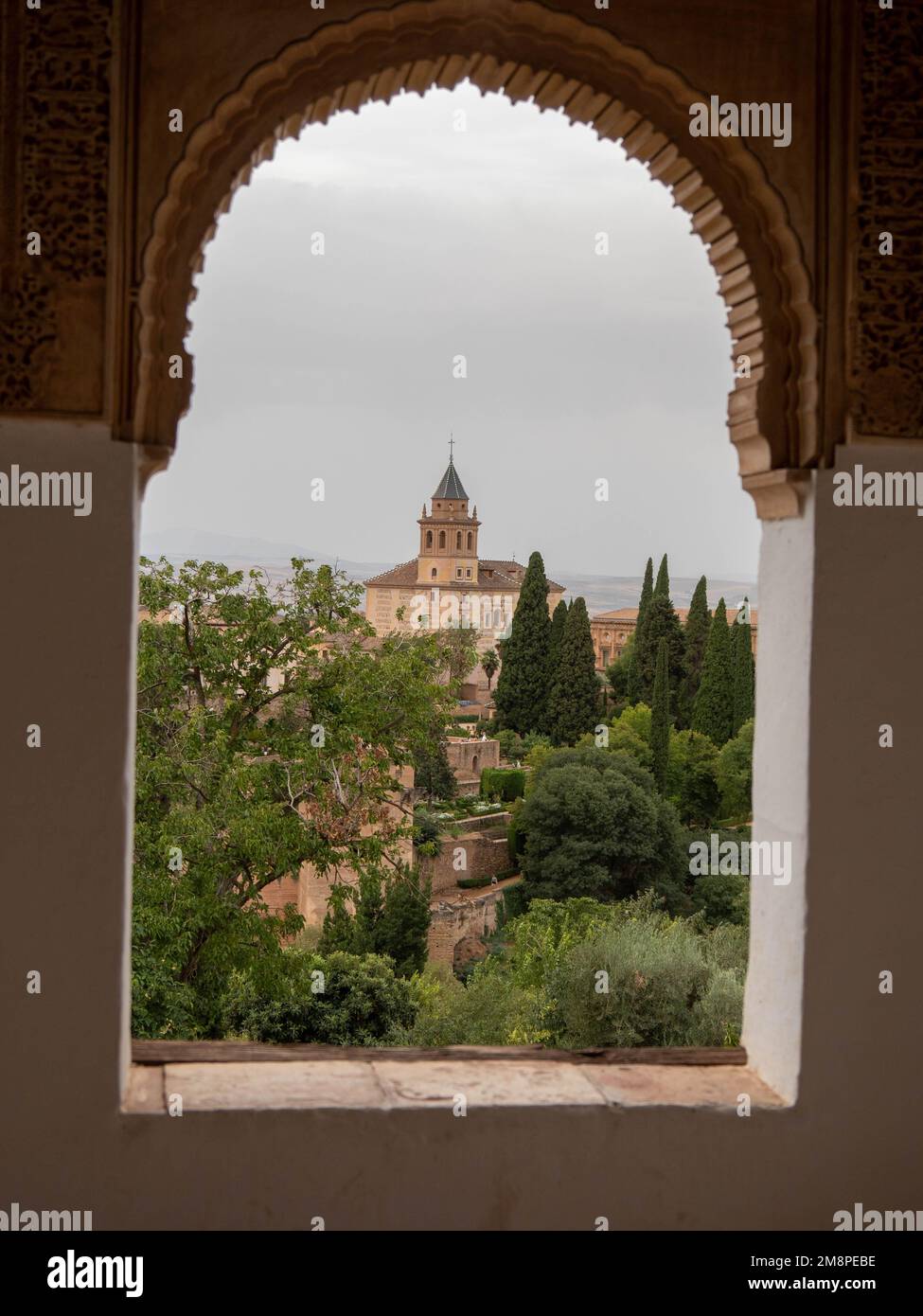 A vertical shot of a beautiful window with the ancient Arabian palace ...