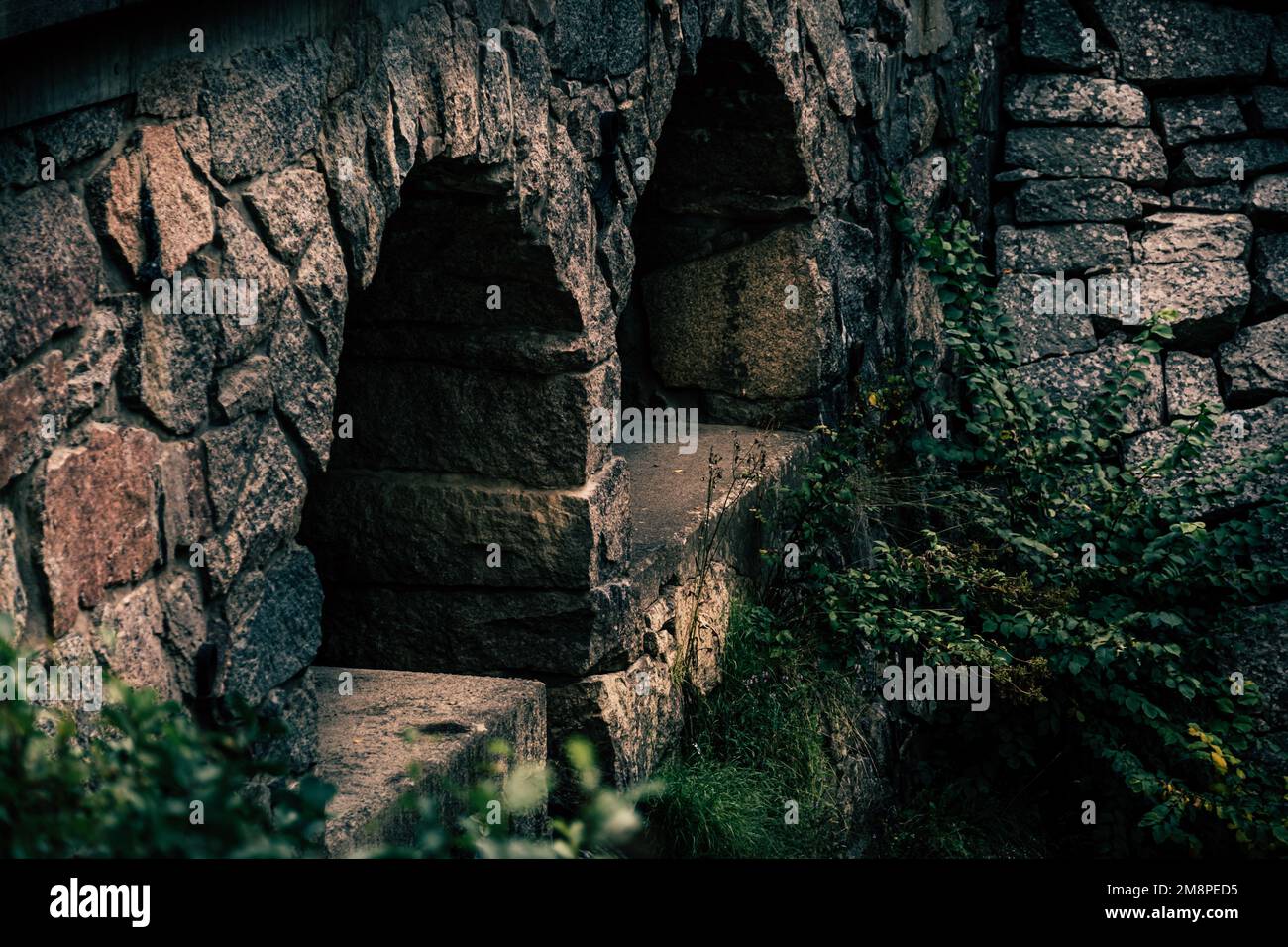 An old stone dam with arch holes Stock Photo - Alamy