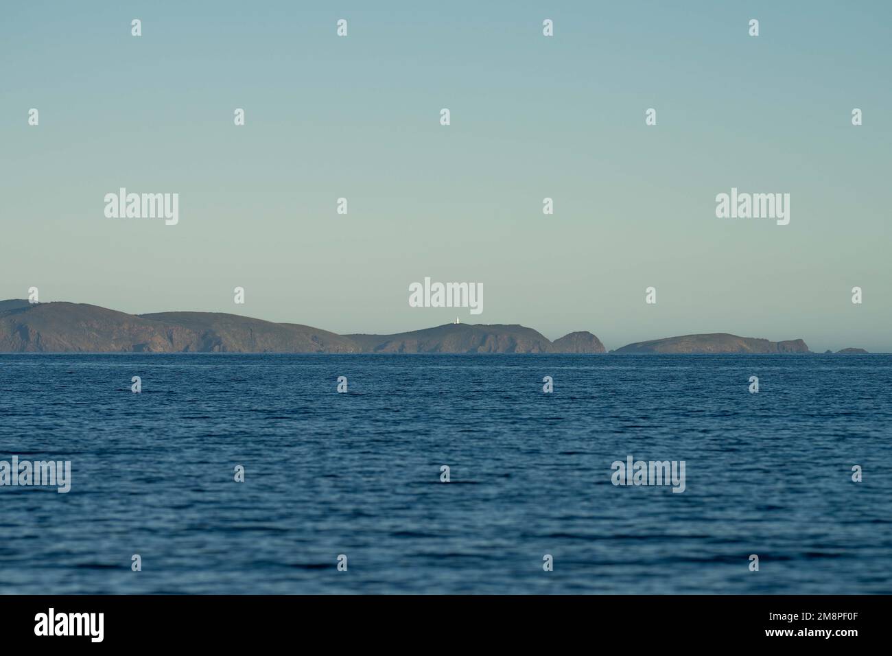 beautiful island on a blue ocean in summer at dusk Stock Photo - Alamy