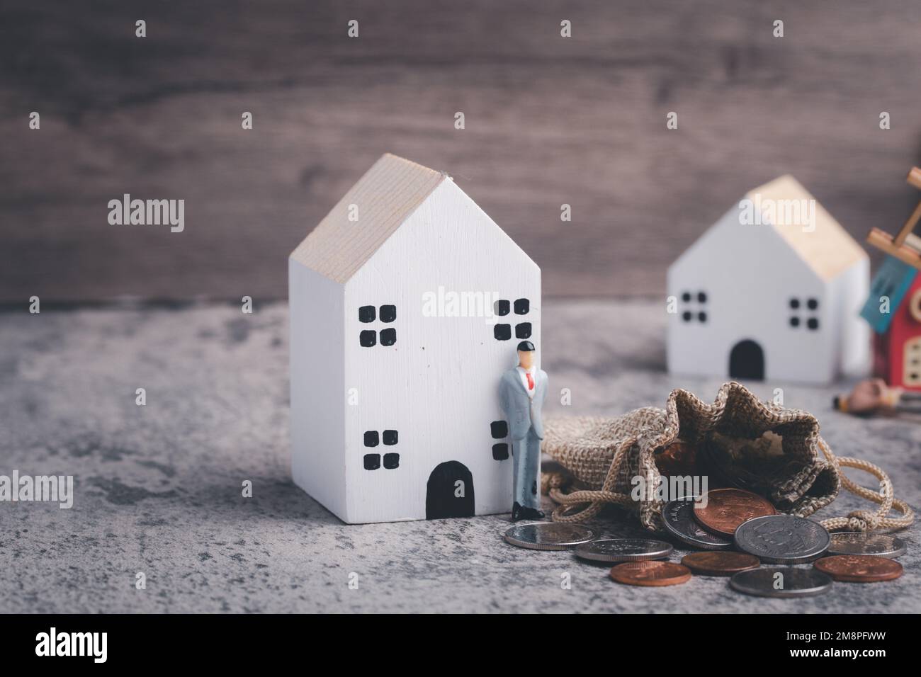 Wooden house and money.real estate purchase concept Stock Photo - Alamy