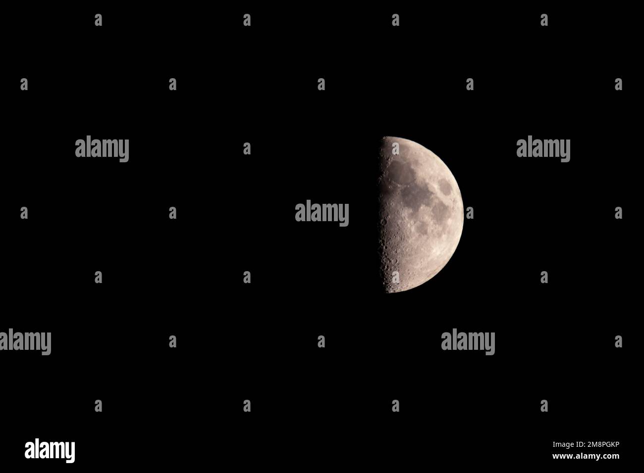 a lunar eclipse the moon is half visible,the background is black Stock ...