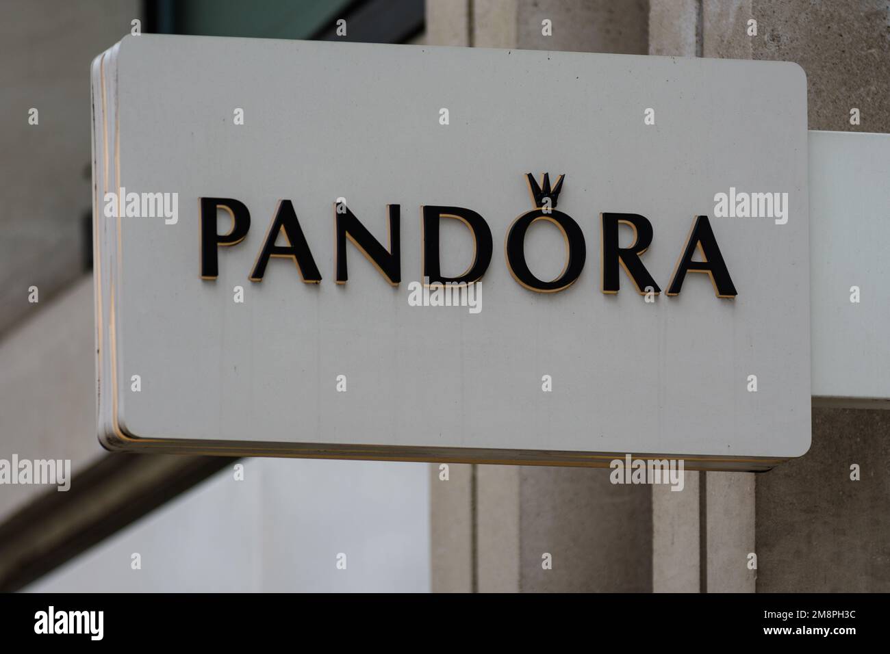 Shop sign for Pandora Jewellery hangs on a high street in central ...