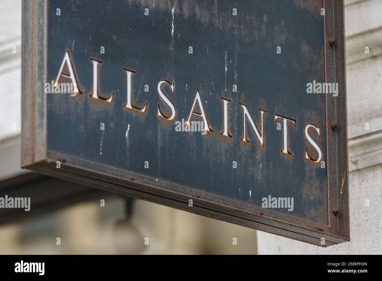 All Saints clothing shop outside a store on a high street in London UK ...