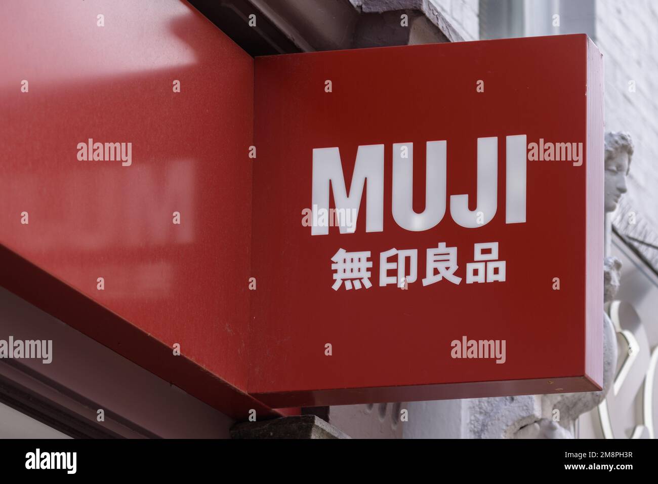 Bright red MUJI sign outside a shop of the popular Japanese retailer in ...