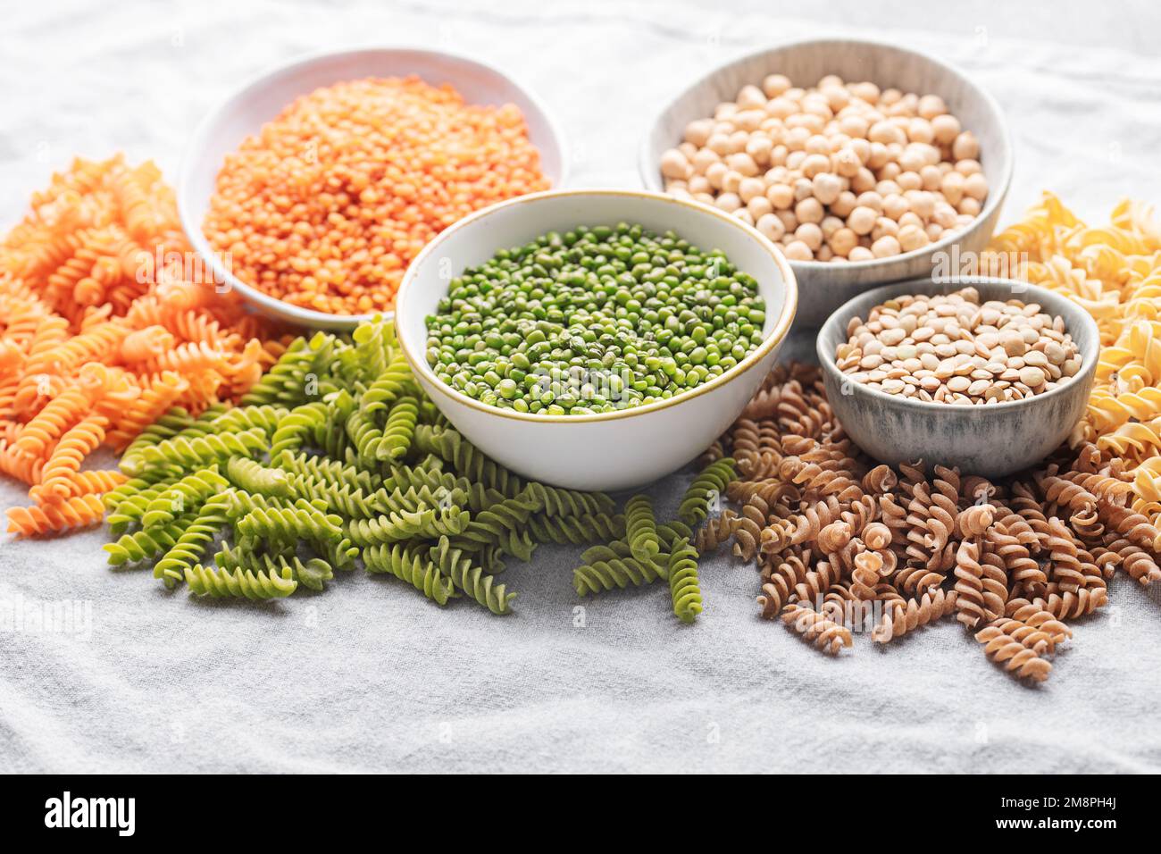 A variety of fusilli pasta made from different types of legumes, green ...