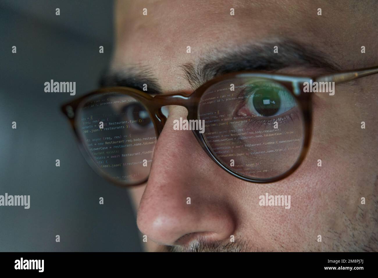 Line of code reflected in glasses of software programmer and web developer Stock Photo - Alamy