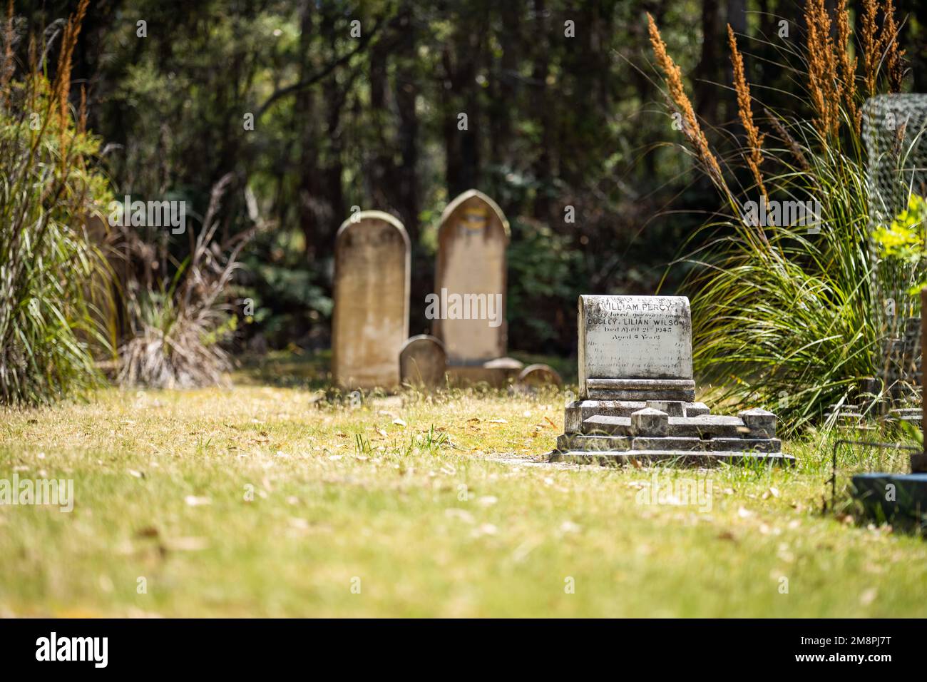 cemetery graves and cross in a graveyard in a church Stock Photo - Alamy