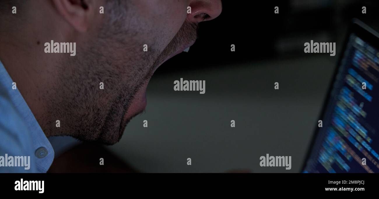 Tired programmer yawning coding and developing software Stock Photo - Alamy