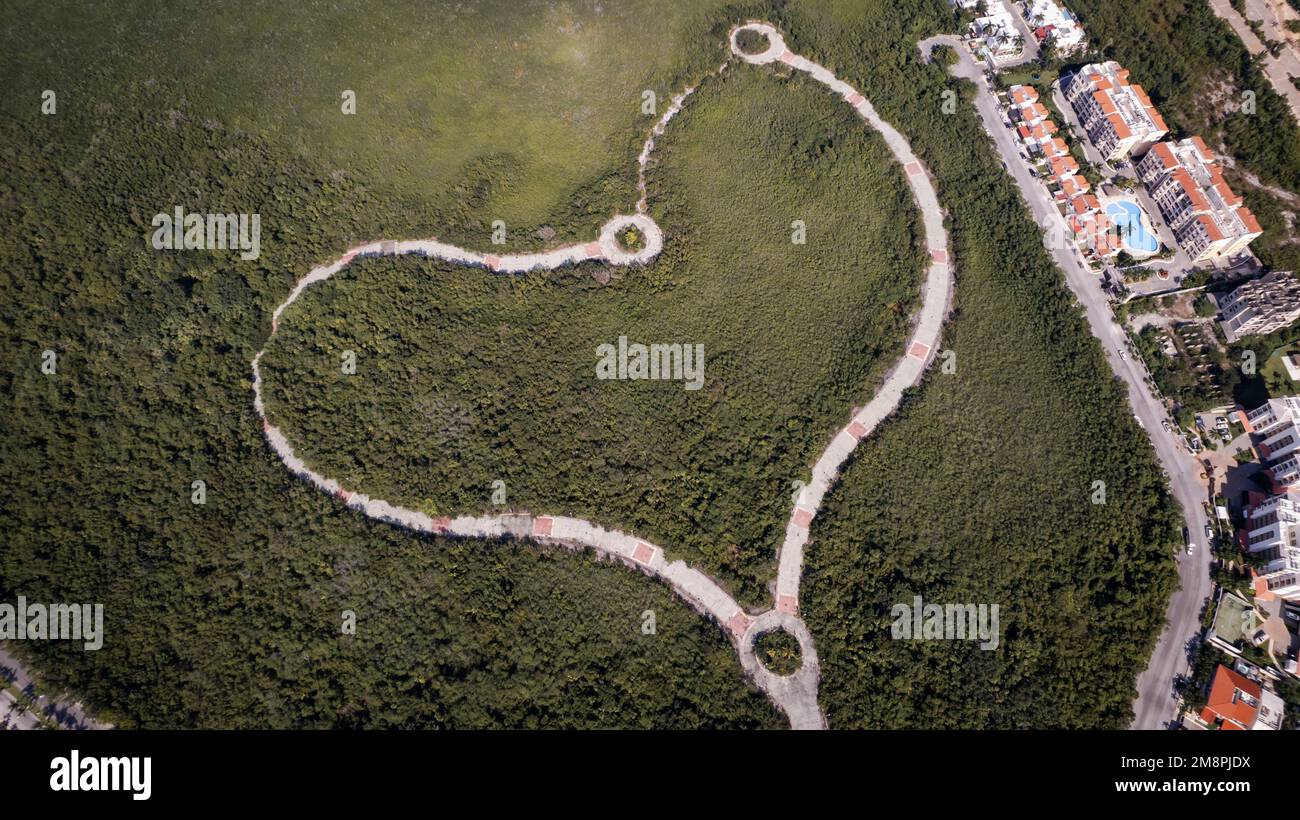 Theme for Valentine's day. Aerial view of a heart shaped road and ...