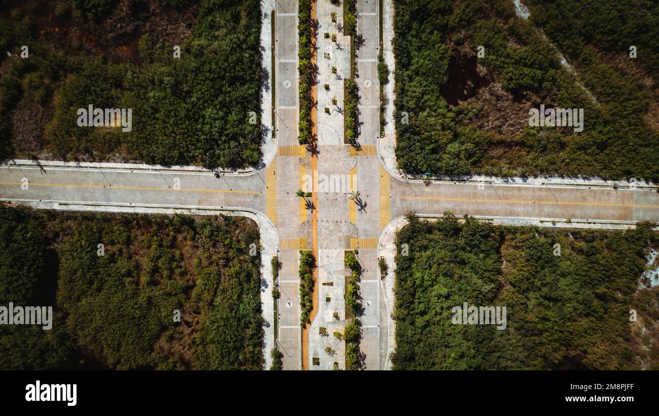 Top down drone photo of an intersection with green landscape in Mexico ...
