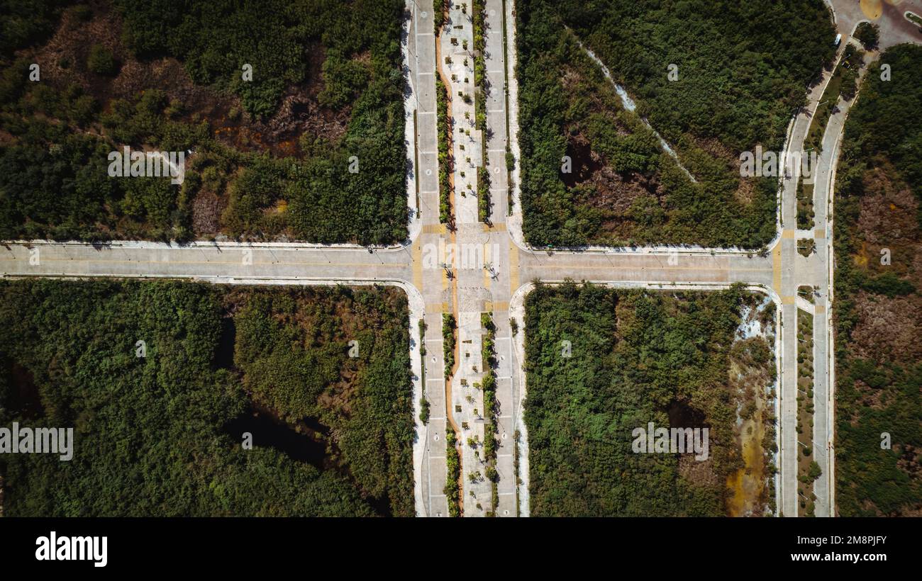 Top down drone photo of an intersection with green landscape in Mexico ...