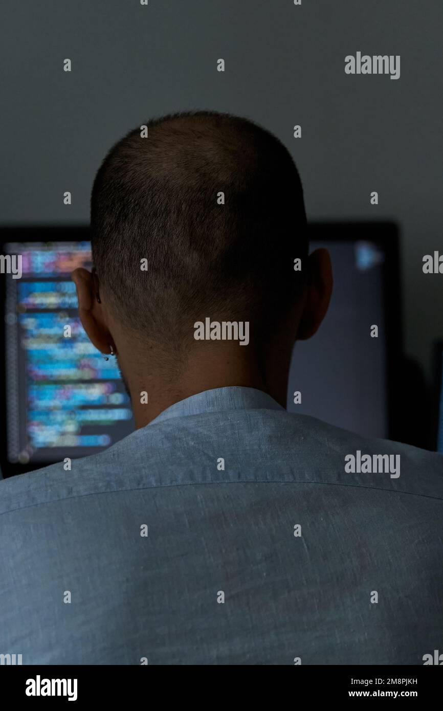 Vertical shot of male writing code. Web developing and software coding ...