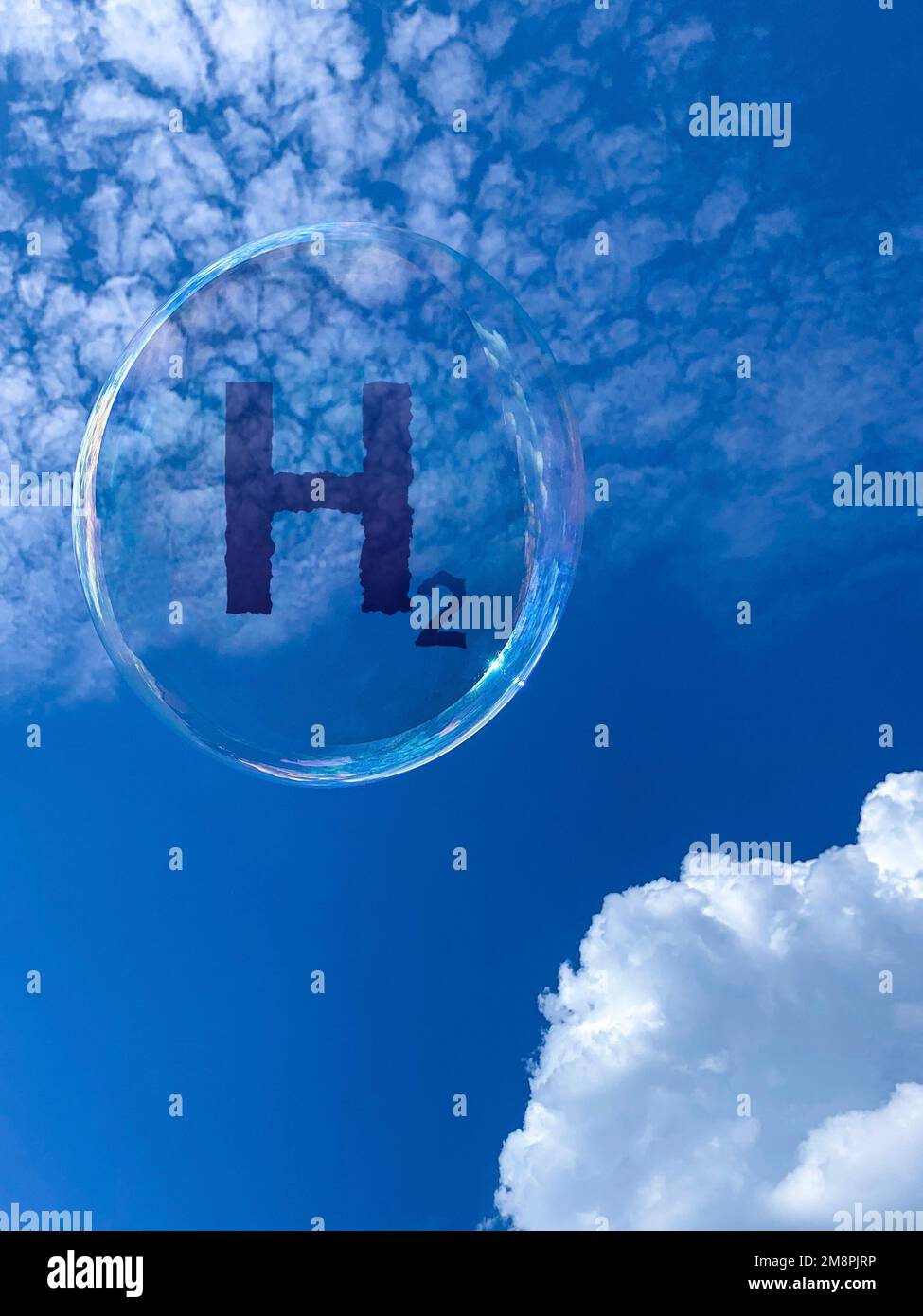Concept for green hydrogen. H2 symbol floating in a clear blue sky ...
