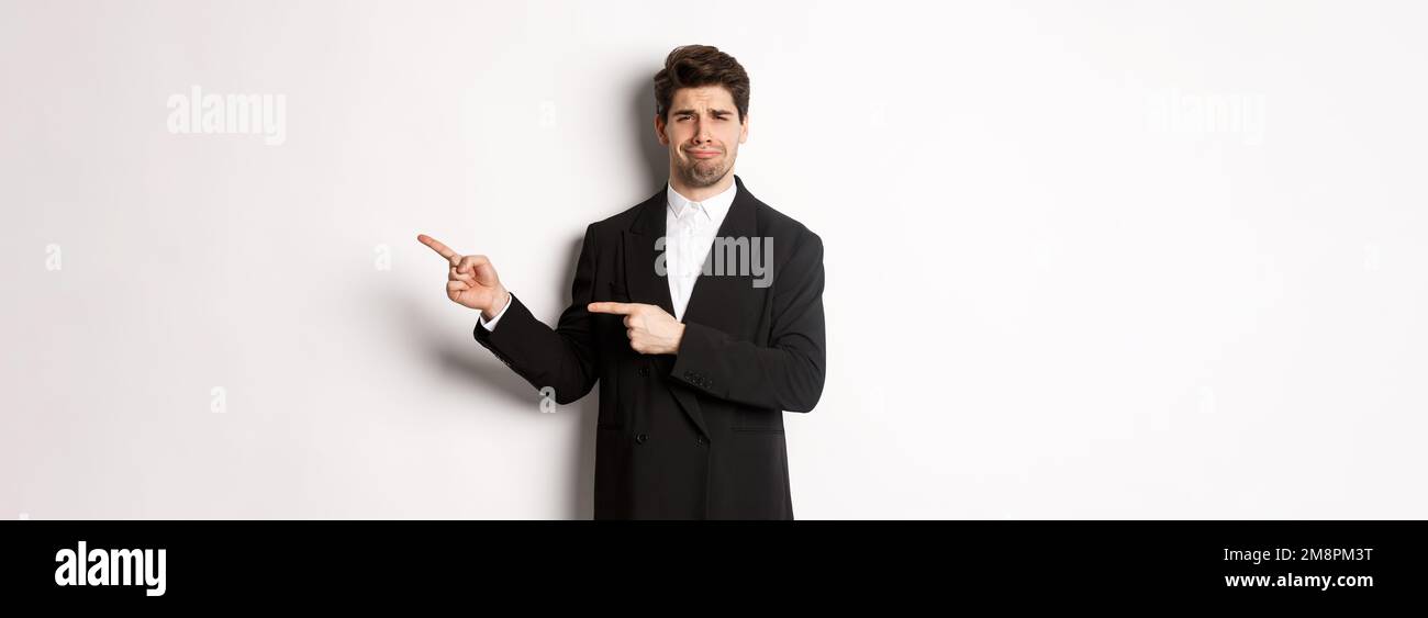 Image of devestated man in party suit, crying and complaining, pointing ...