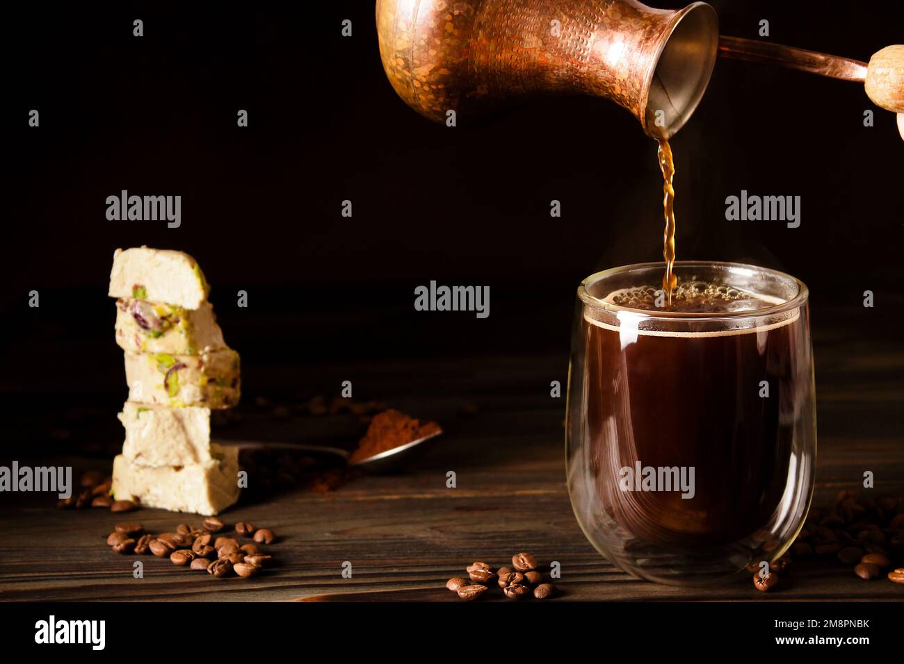 Fresh black coffee brewed in the correct narrow-necked cezve. Turkish ...