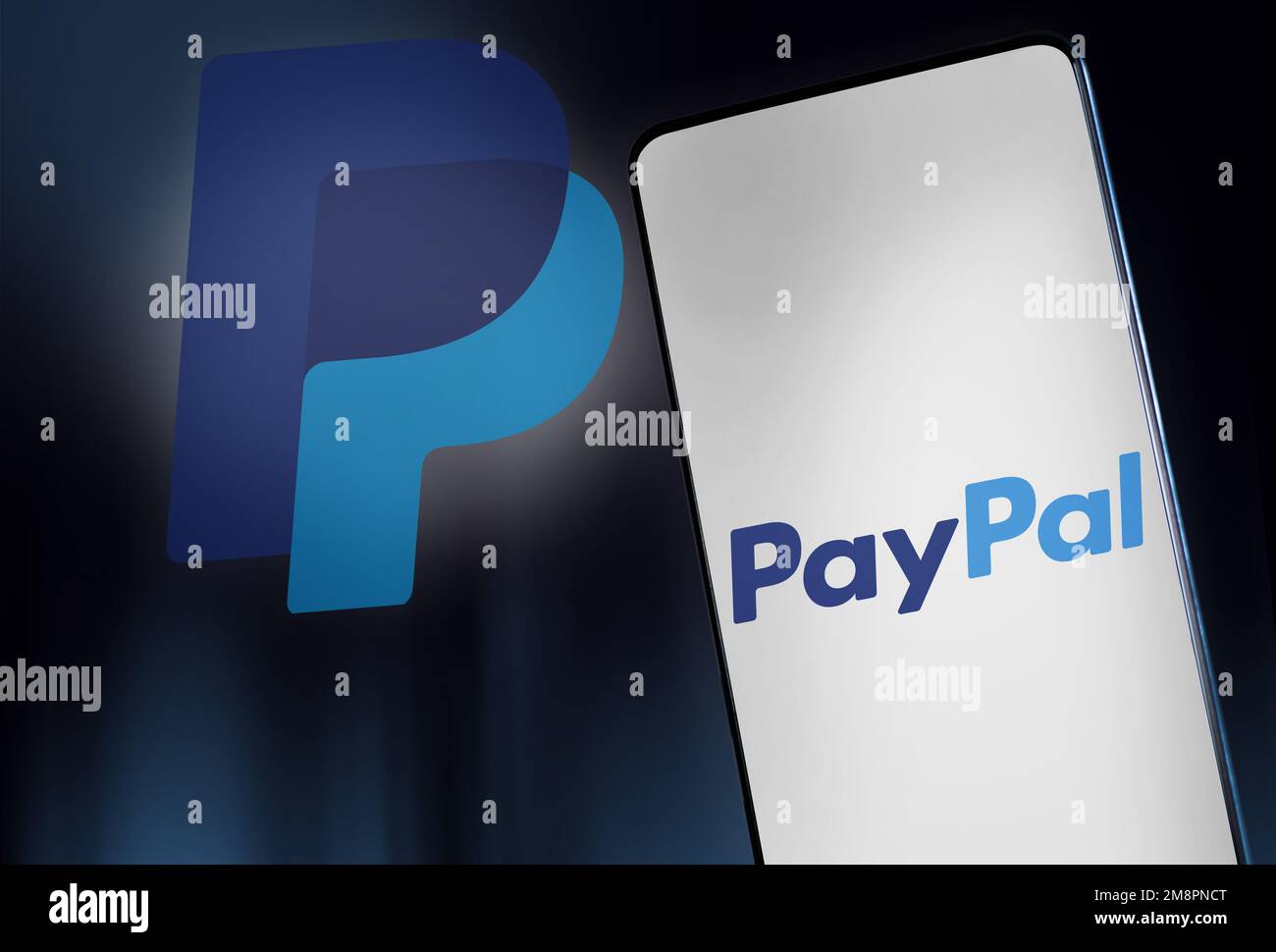 PayPal logo on smartphone display and background. E-payment concept ...