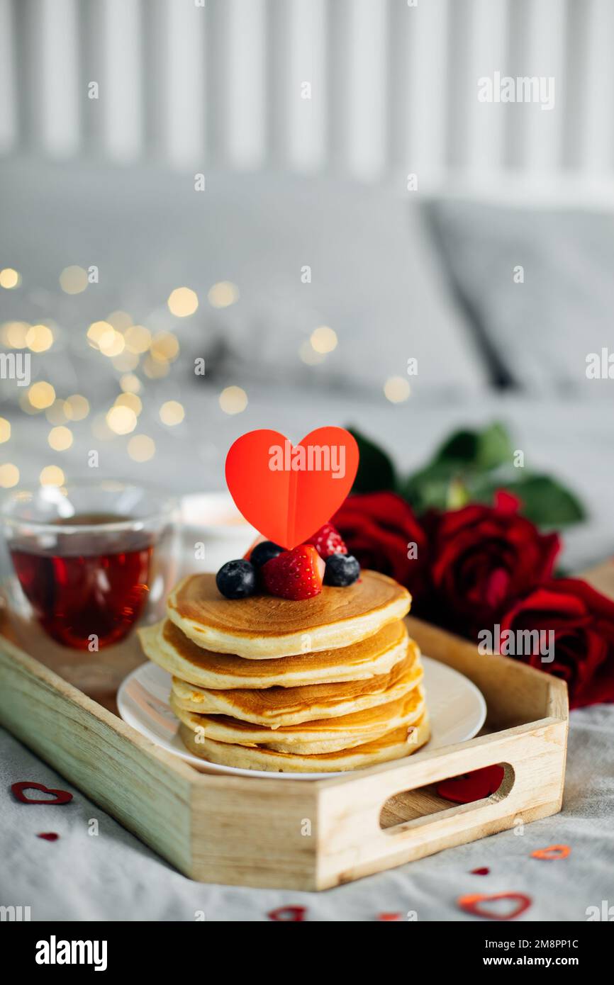 Valentine's day breakfast or brunch. Homemade pancakes with berries ...