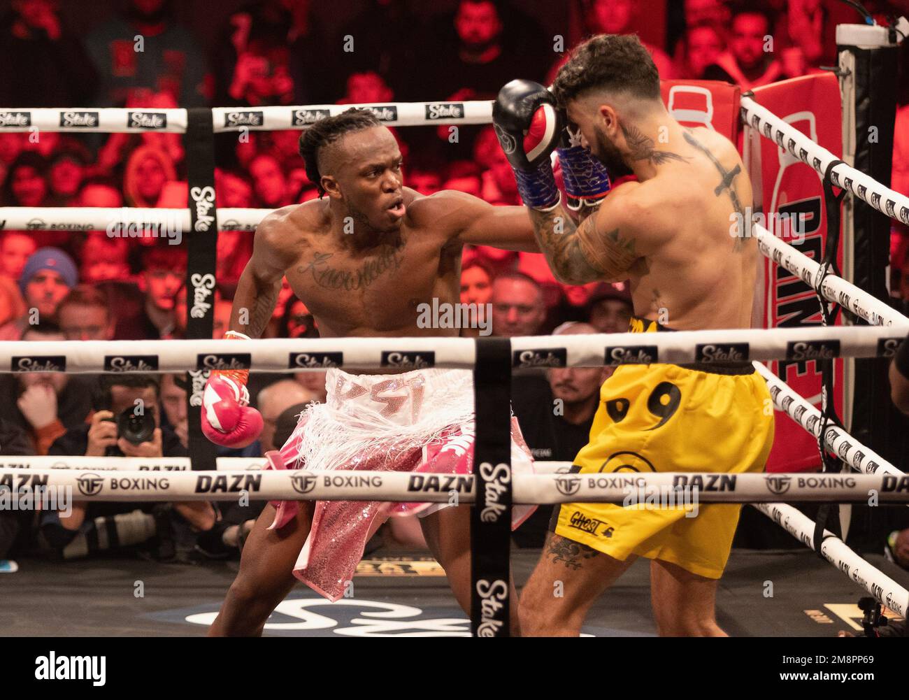 KSI (left) strikes FaZe Temperrr in the cruiserweight bout at the OVO ...