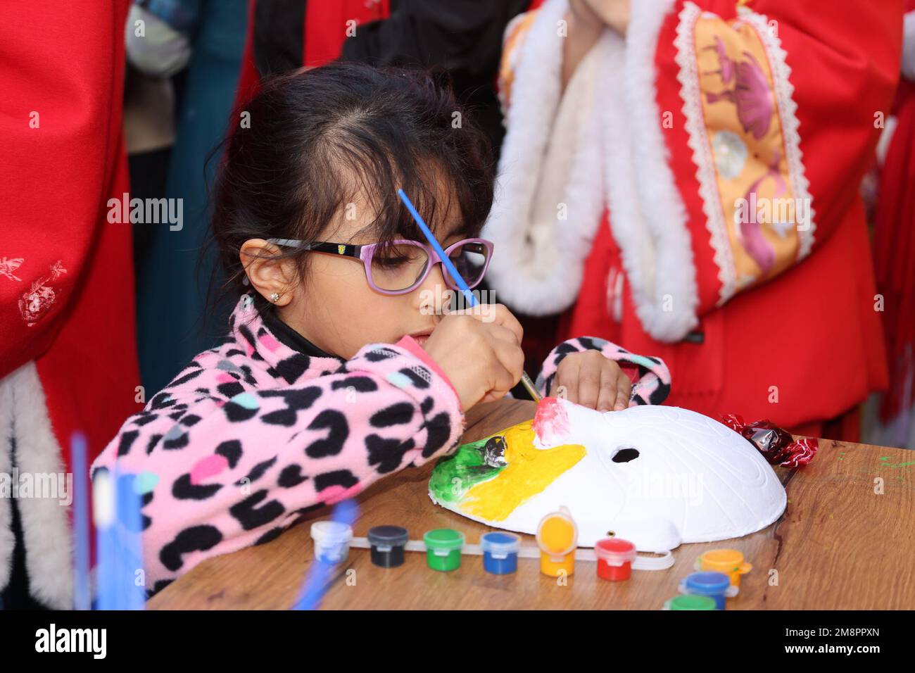 Riyadh, Saudi Arabia. 14th Jan, 2023. A kid paints a mask of Peking ...