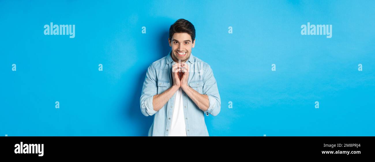 Funny cunning man having evil plan, scheming something and smiling ...