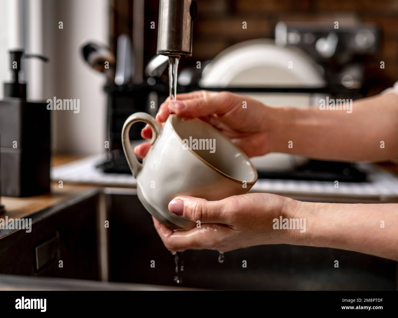 Hand filling glass drinking water hi-res stock photography and images ...