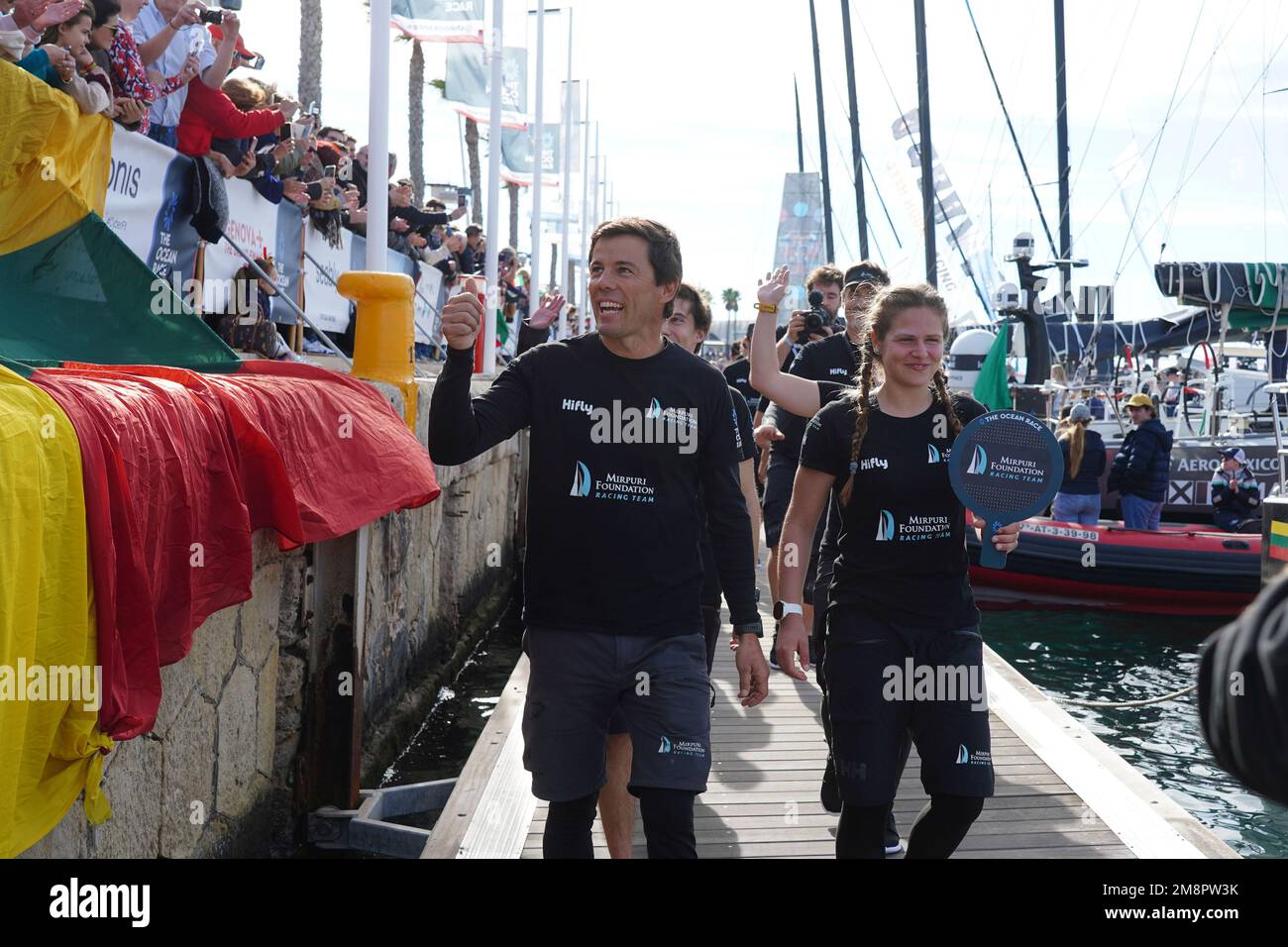 The VO65 Class Portuguese Mirpuri Foundation Racing Team members wave ...