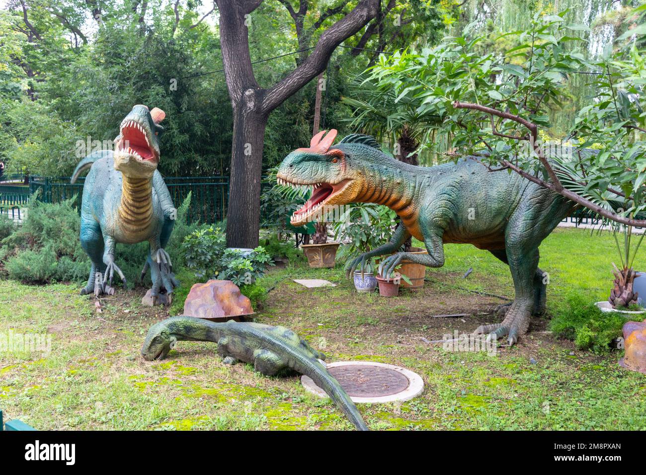 The model dinosaur in the park Stock Photo - Alamy