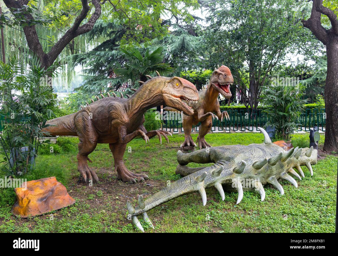 The model dinosaur in the park Stock Photo - Alamy