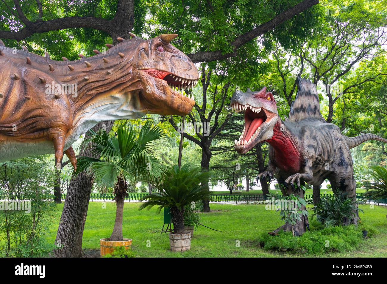 The model dinosaur in the park Stock Photo - Alamy