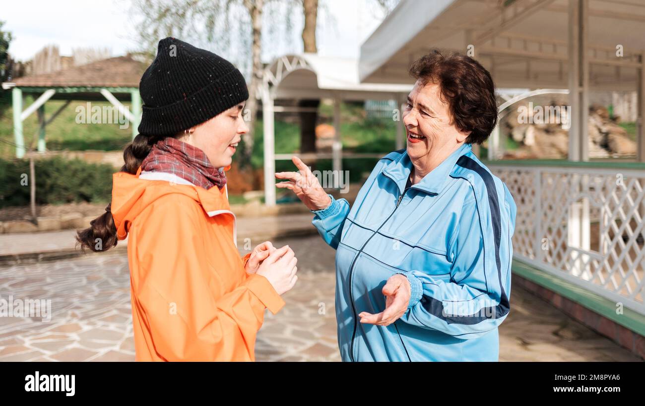 Two older people talking street hi-res stock photography and images - Alamy