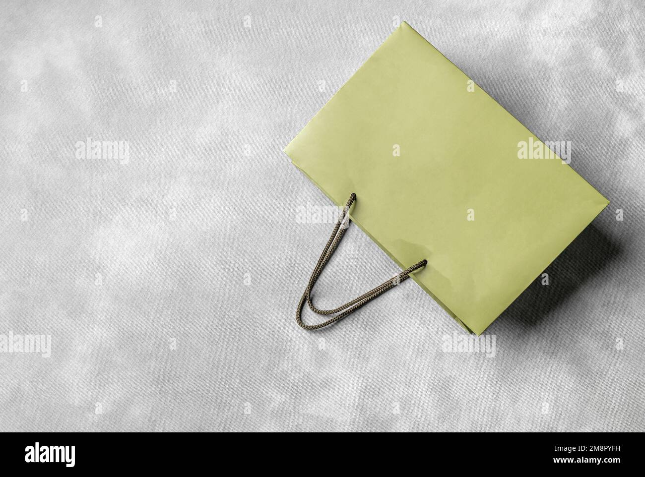 Gift paper bag with handles Stock Photo - Alamy
