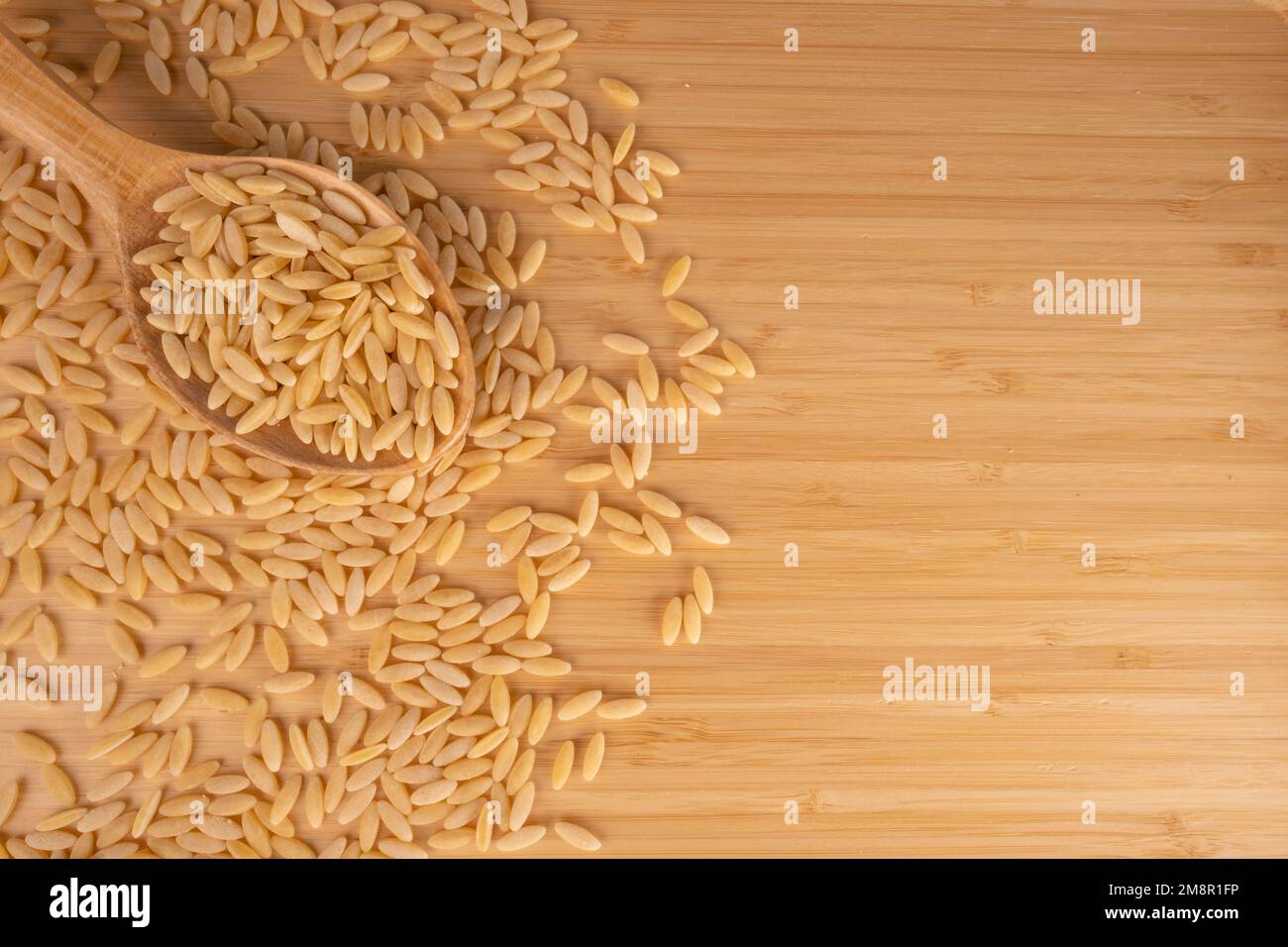 Grains Of Barley Noodle On A Wooden Floor, Top View. Raw Barley Noodle ...