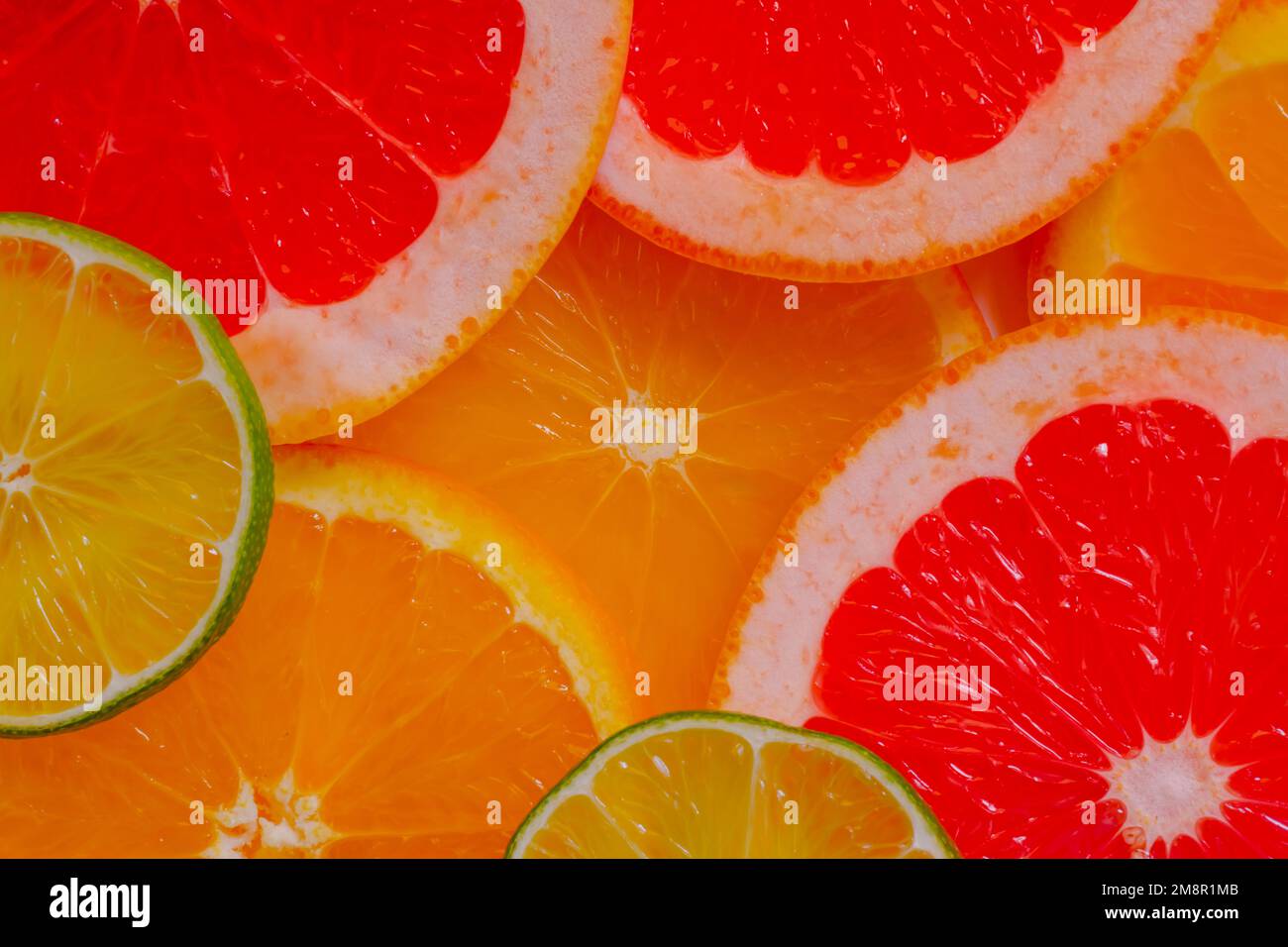 Top view: citrus fruits slices - lemon, orange, grapefruit and lime - close up Stock Photo - Alamy